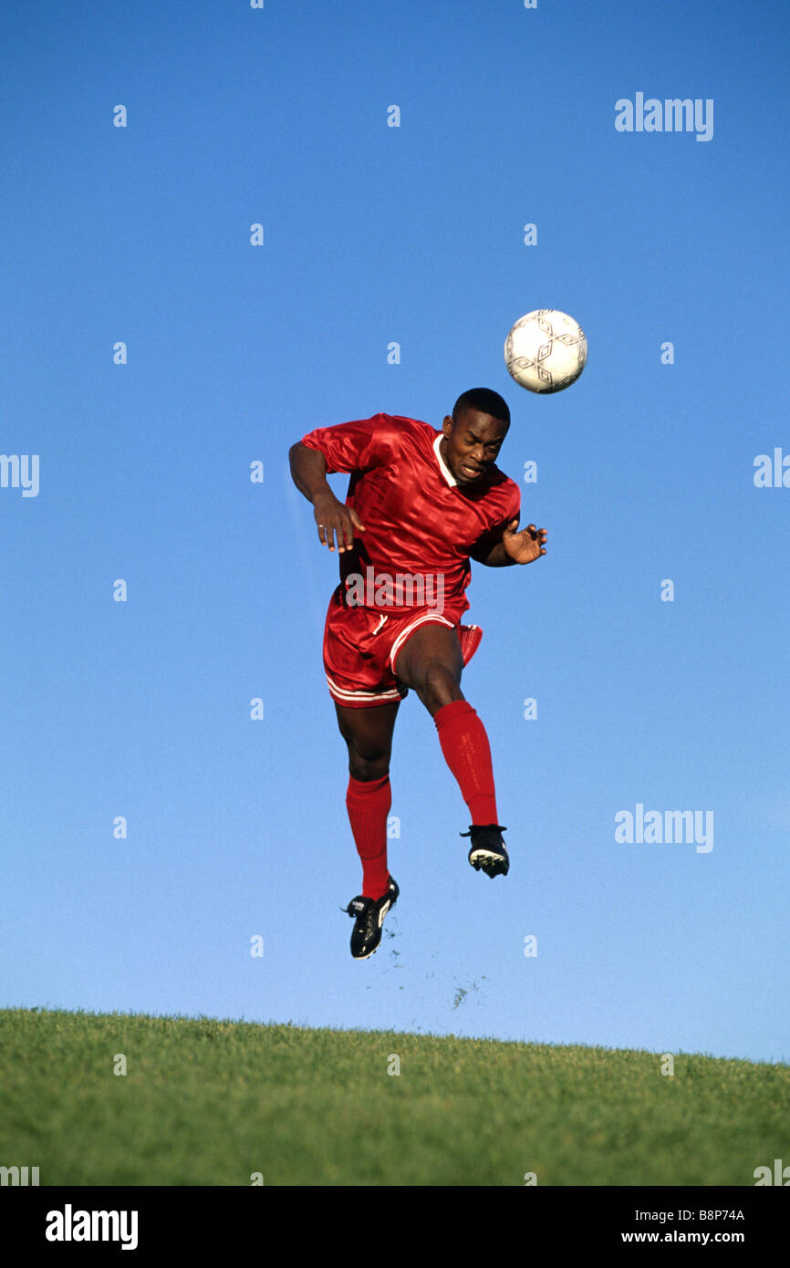 Soccer player heading the ball Stock Photo - Alamy