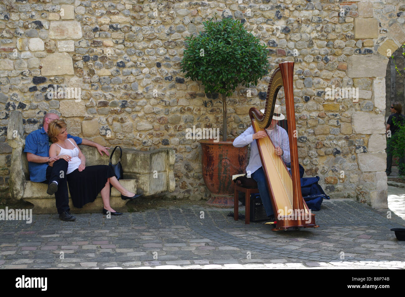 Playing harp france hi-res stock photography and images - Alamy