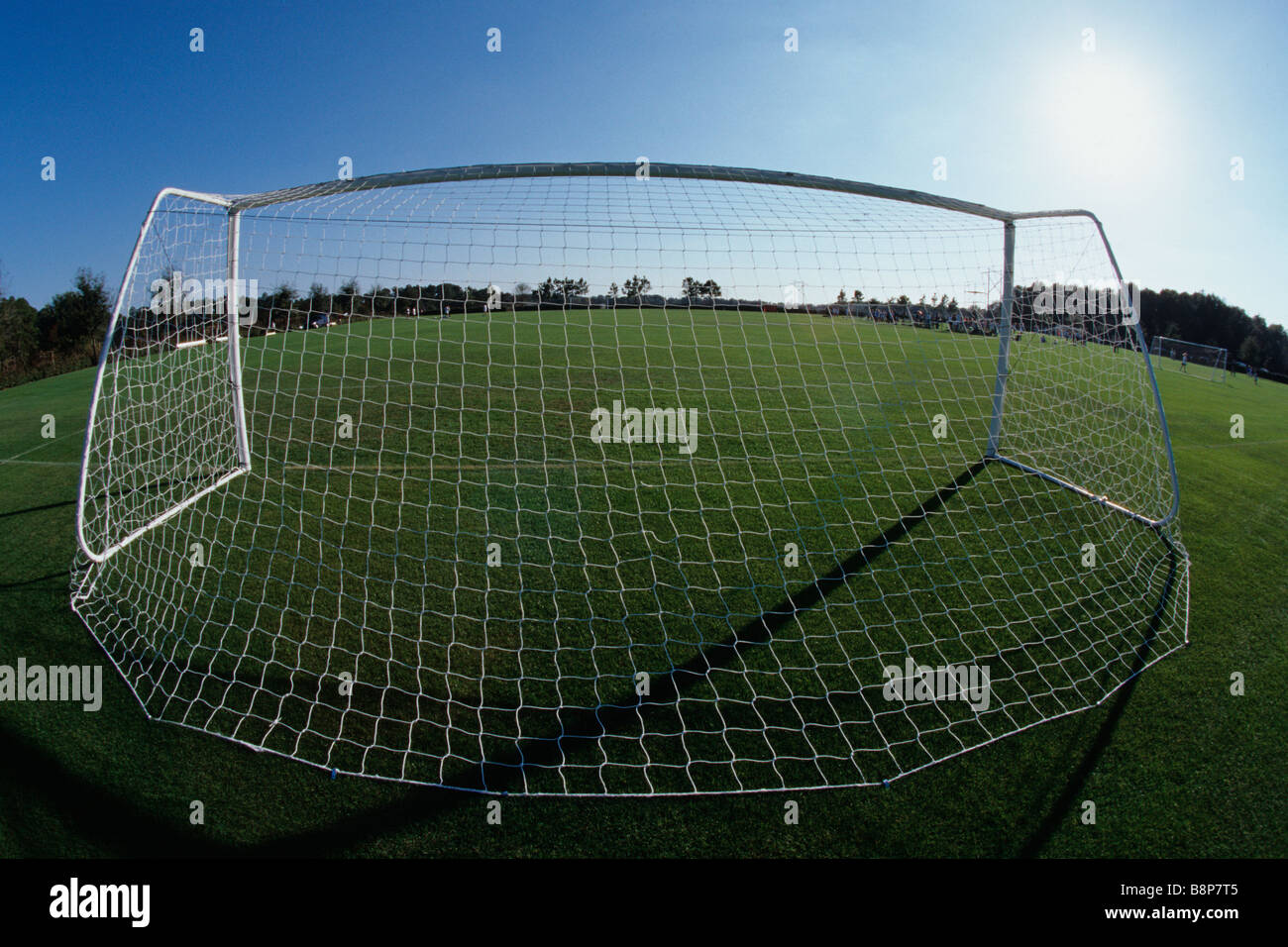 View of soccer field through goal Stock Photo - Alamy