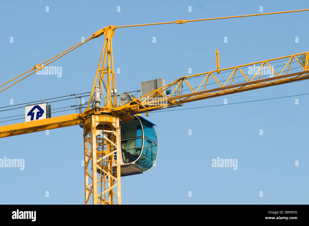 Yellow and blue tower crane hi-res stock photography and images - Alamy