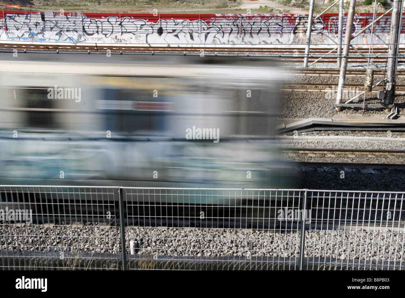 fast metro train covered with graffiti on tracks Stock Photo - Alamy