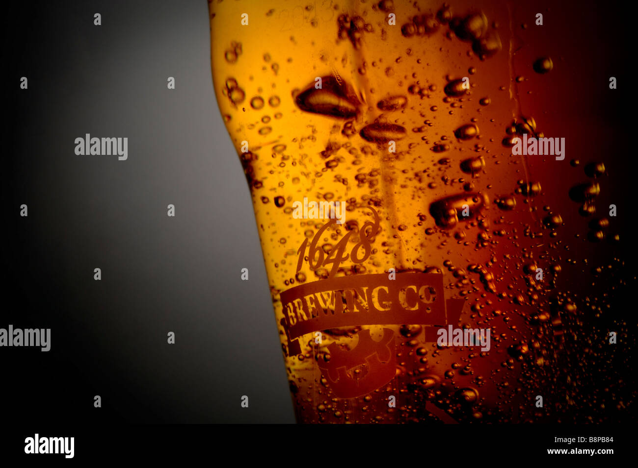 A pint of beer being poured in a country pub brewed by microbrewery ...