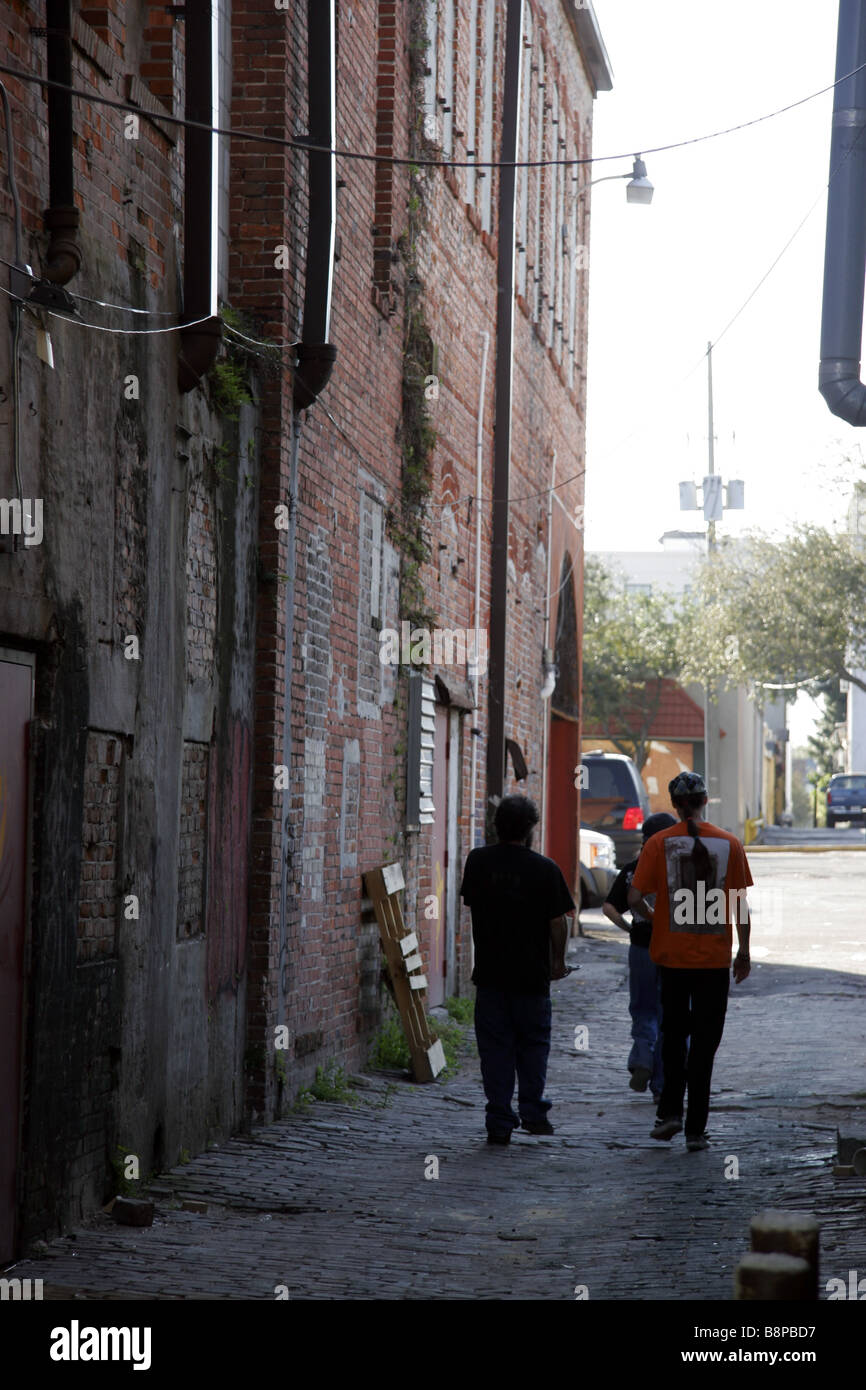 Man walking down back alley hi-res stock photography and images - Alamy