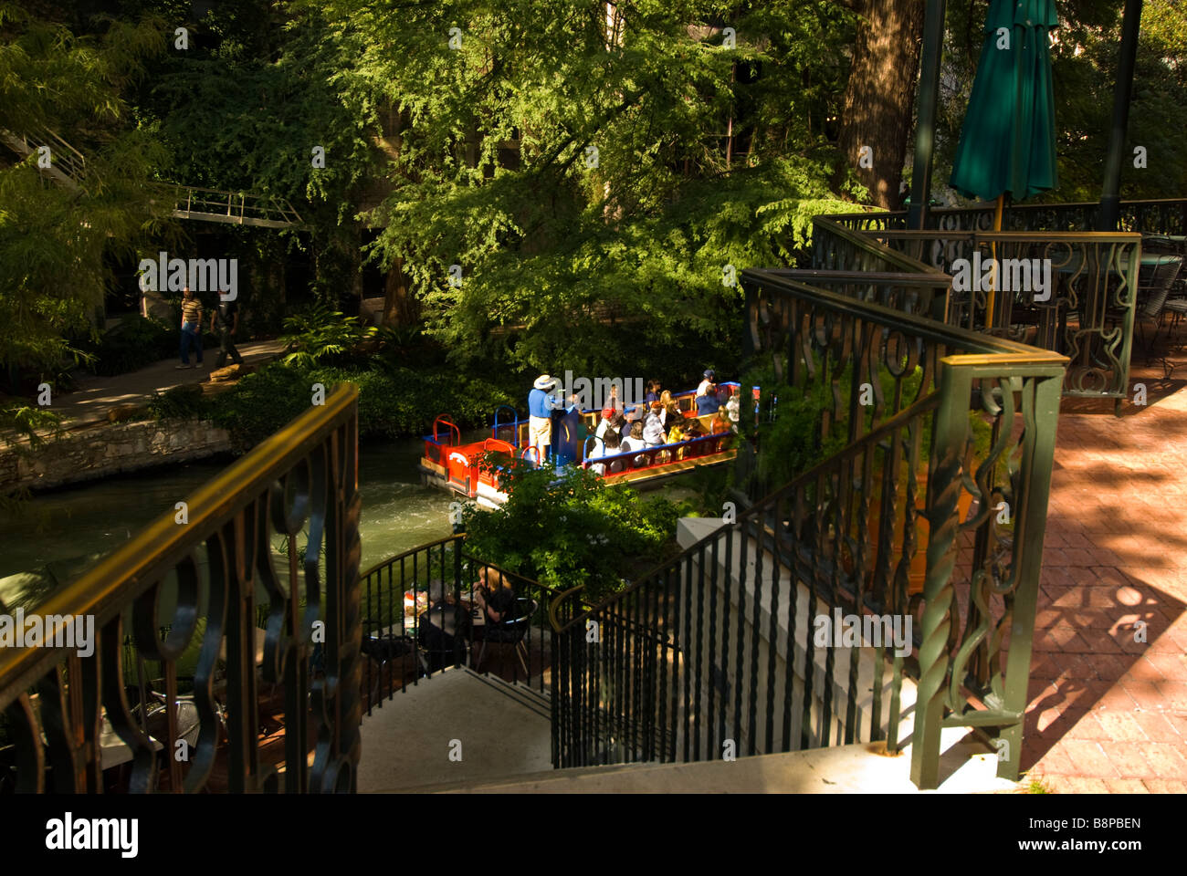 San Antonio River Walk riverwalk above tour boat with passengers passes ...