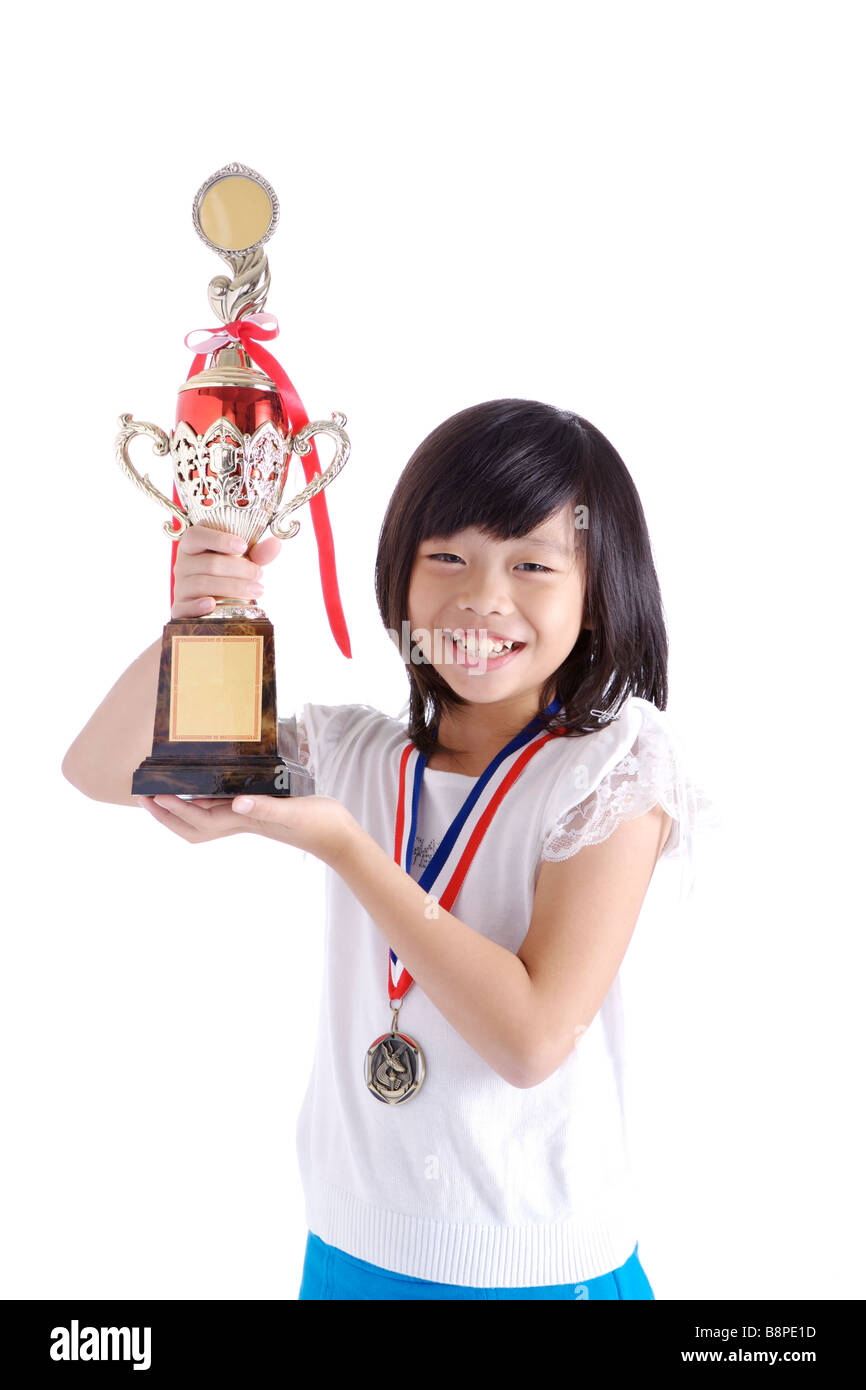 Girl lifting trophy portrait Stock Photo - Alamy
