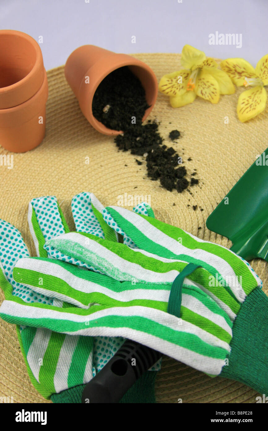 gardening gloves potting soil flowers new spring Stock Photo - Alamy