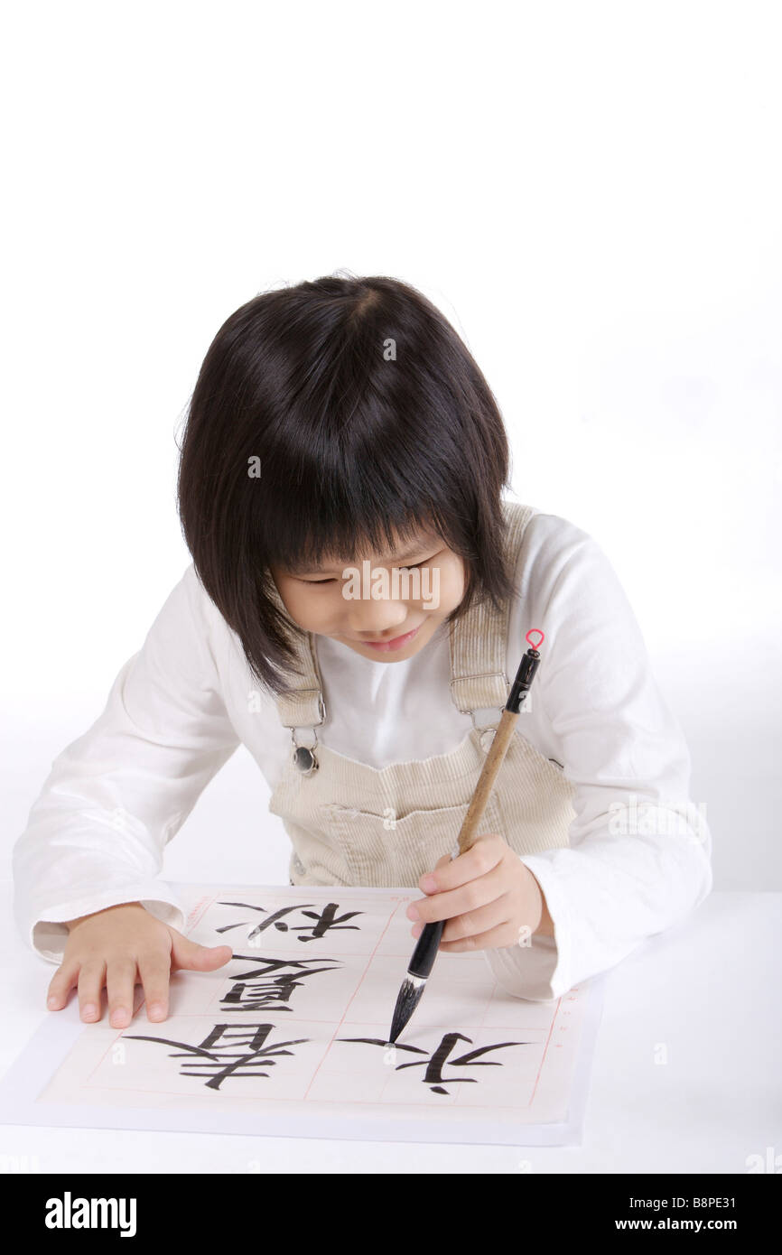 Girl practicing calligraphy Stock Photo - Alamy