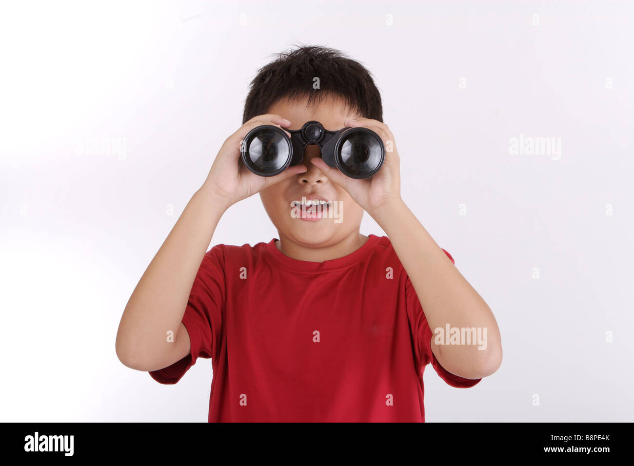 Boy using telescope portrait Stock Photo - Alamy