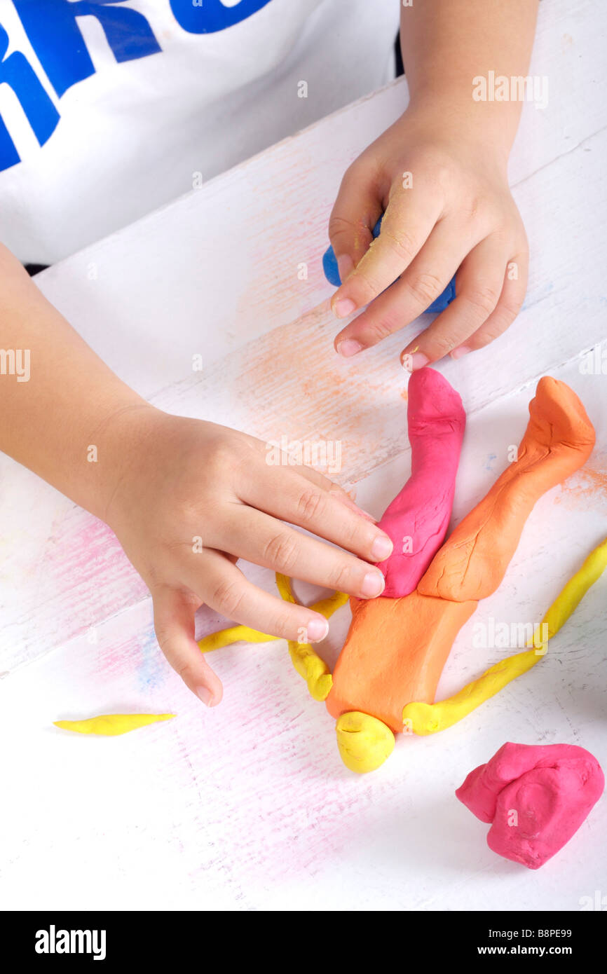 Boy playing child s play clay Stock Photo - Alamy