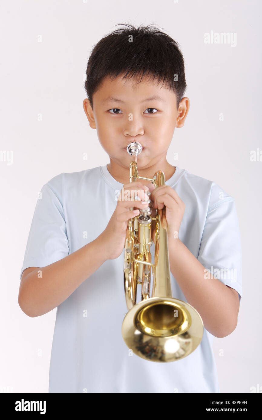 Boy with trumpet hi-res stock photography and images - Alamy