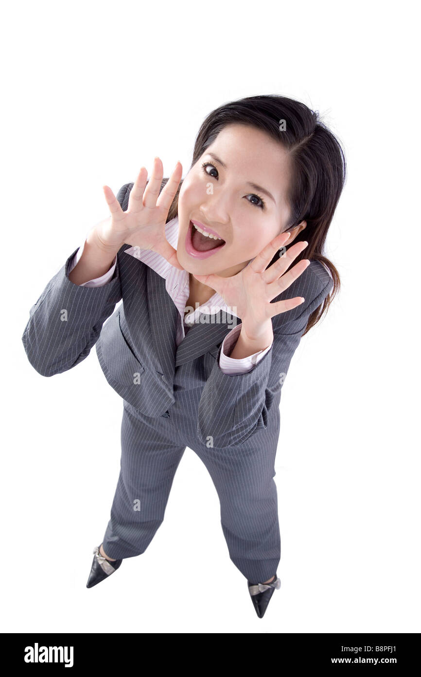 Young businesswoman making shouting gesture Stock Photo - Alamy