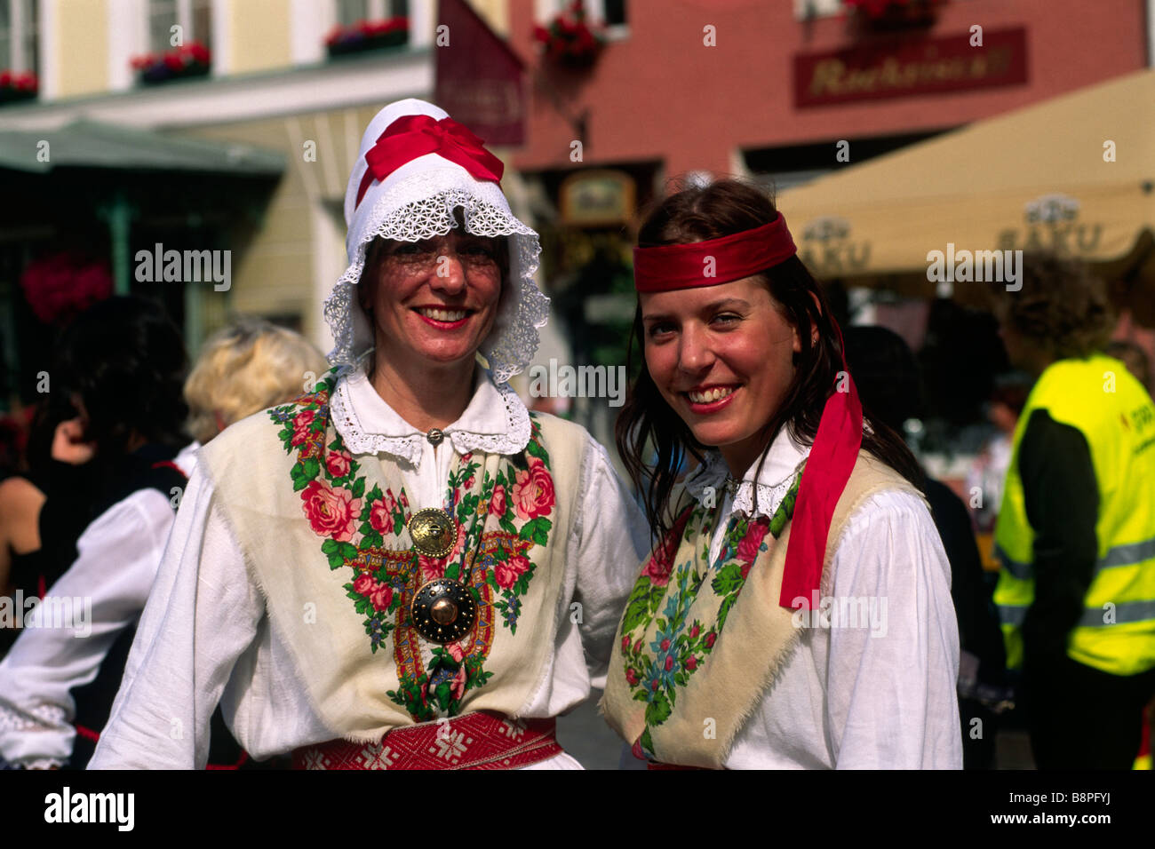 Estonia, Tallinn, Raekoja Plats, women wearing traditional clothes ...