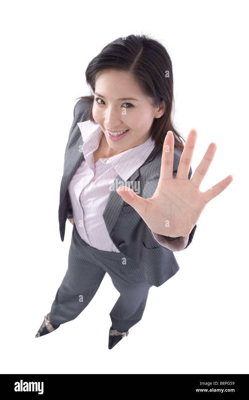Young businesswoman making stop gesture portrait Stock Photo - Alamy