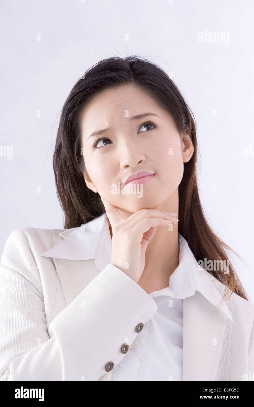 Young woman hand on chin portrait Stock Photo - Alamy