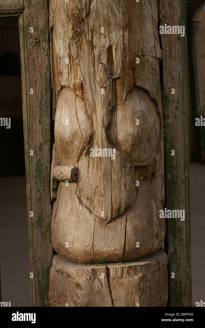 Wood carving on the column outside of stone house built by Qing ...