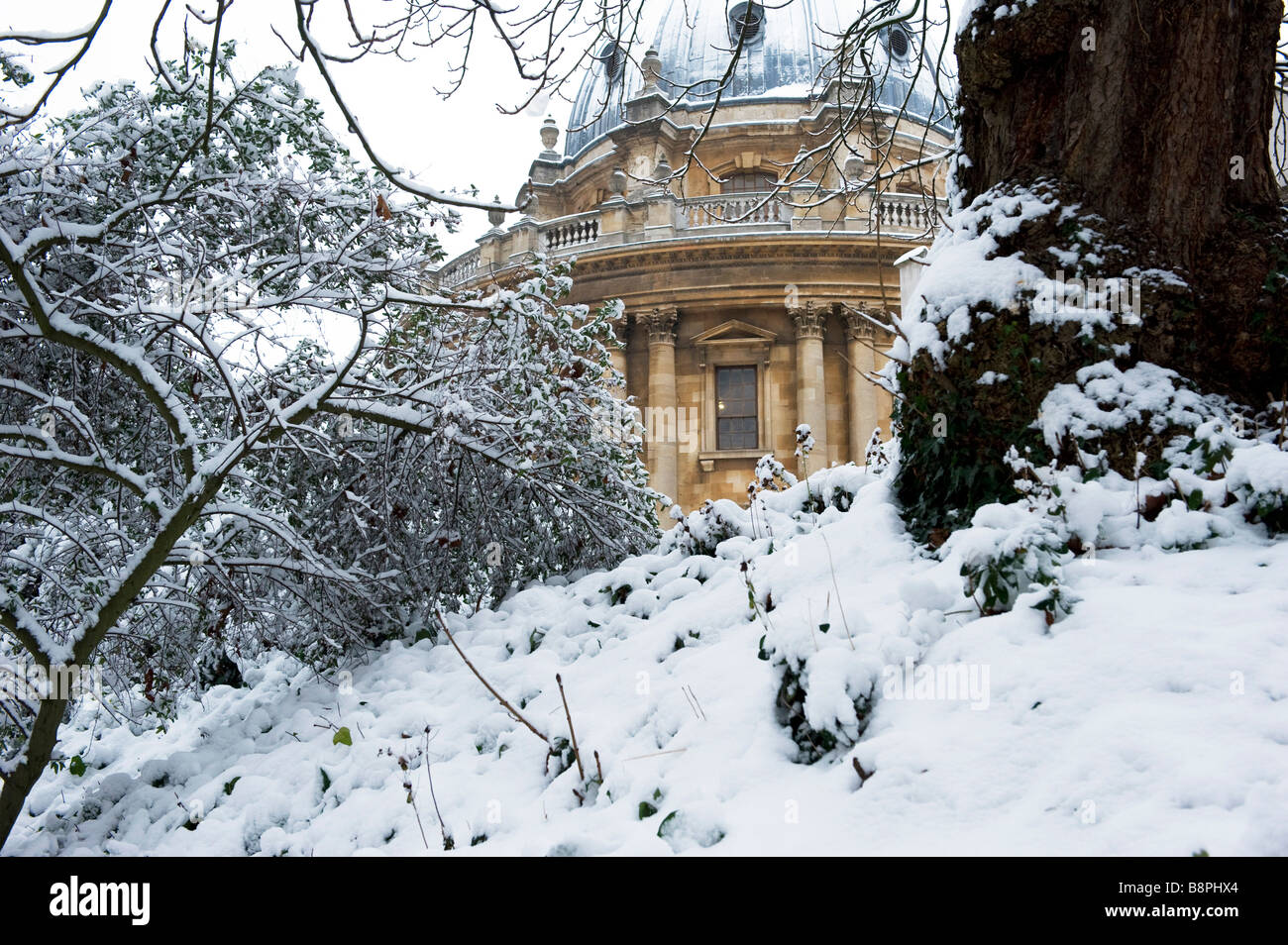 Radcliffe camera seen through snow covered gardens of Exeter College ...