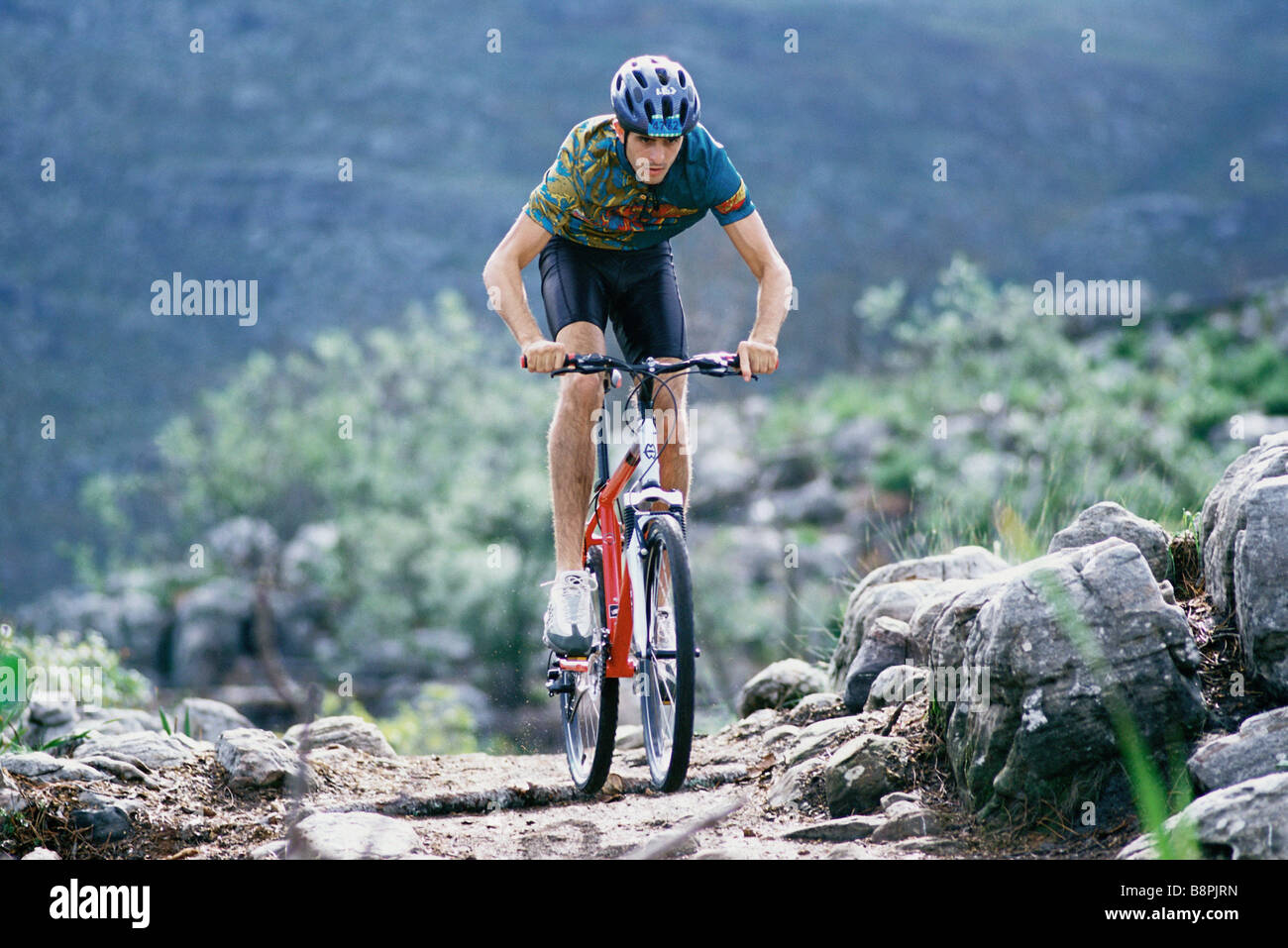 Man riding mountain bike Stock Photo - Alamy