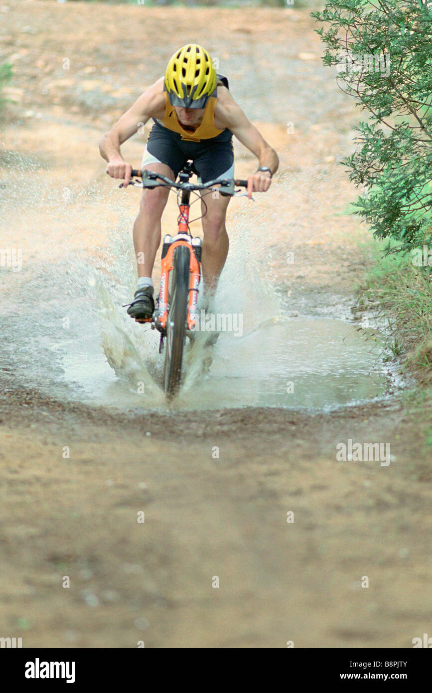 Cycling through puddles hi-res stock photography and images - Alamy