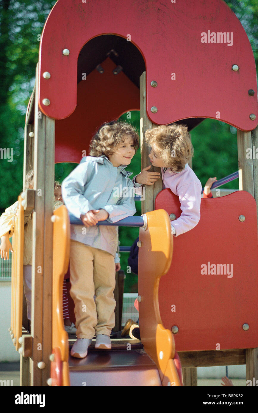 Children playing on slide Stock Photo - Alamy
