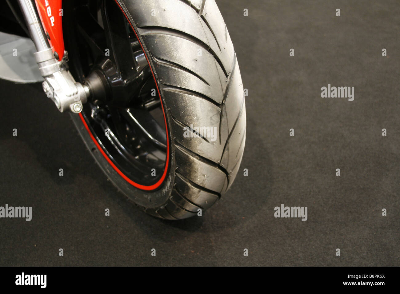 close up of tyre tire grip on scooter motorbike at motor show Stock ...