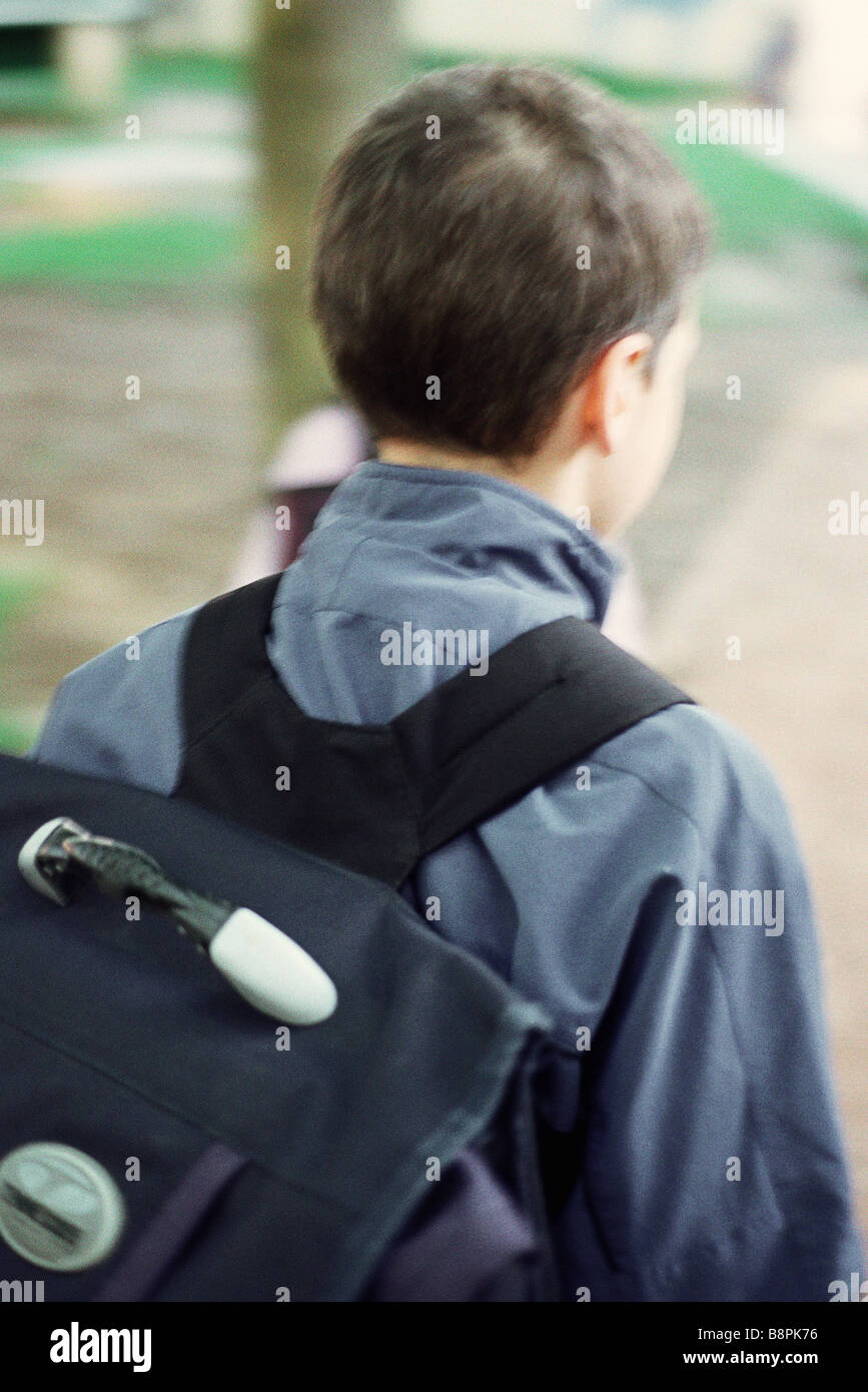 Boy wearing backpack, rear view Stock Photo - Alamy