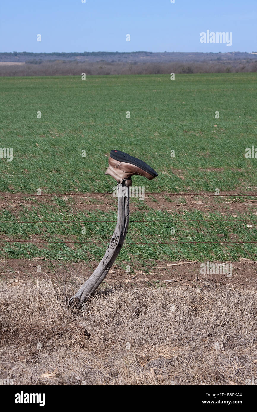Boot on a fence post Stock Photo - Alamy