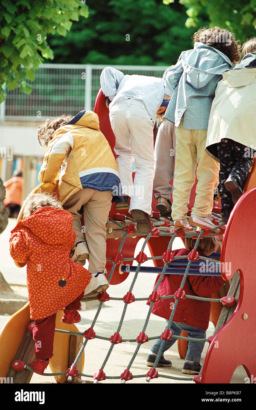 Children playing on playground equipment Stock Photo - Alamy