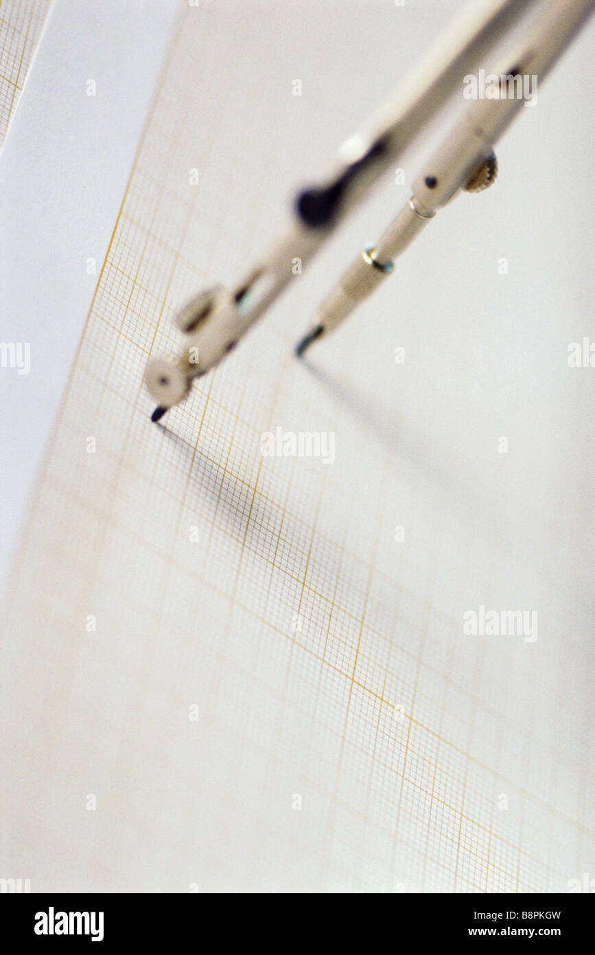 Drawing compass on graph paper Stock Photo - Alamy
