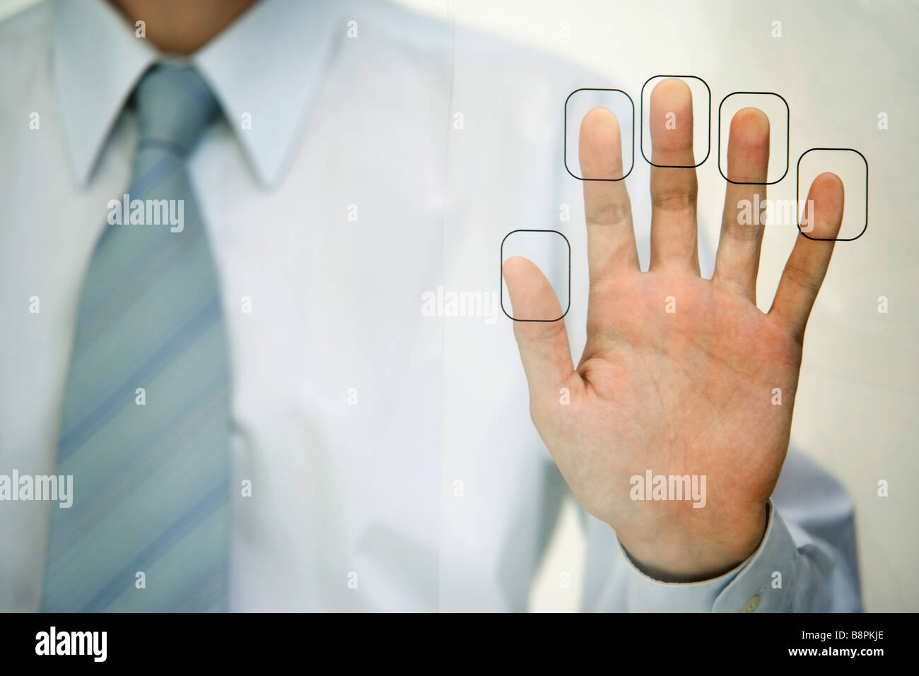 Man pressing fingertips to fingerprint reader Stock Photo - Alamy