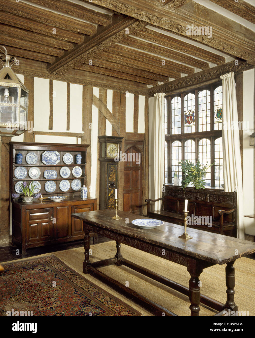 The half timbered hall at Paycockes with finely carved ceiling and ...