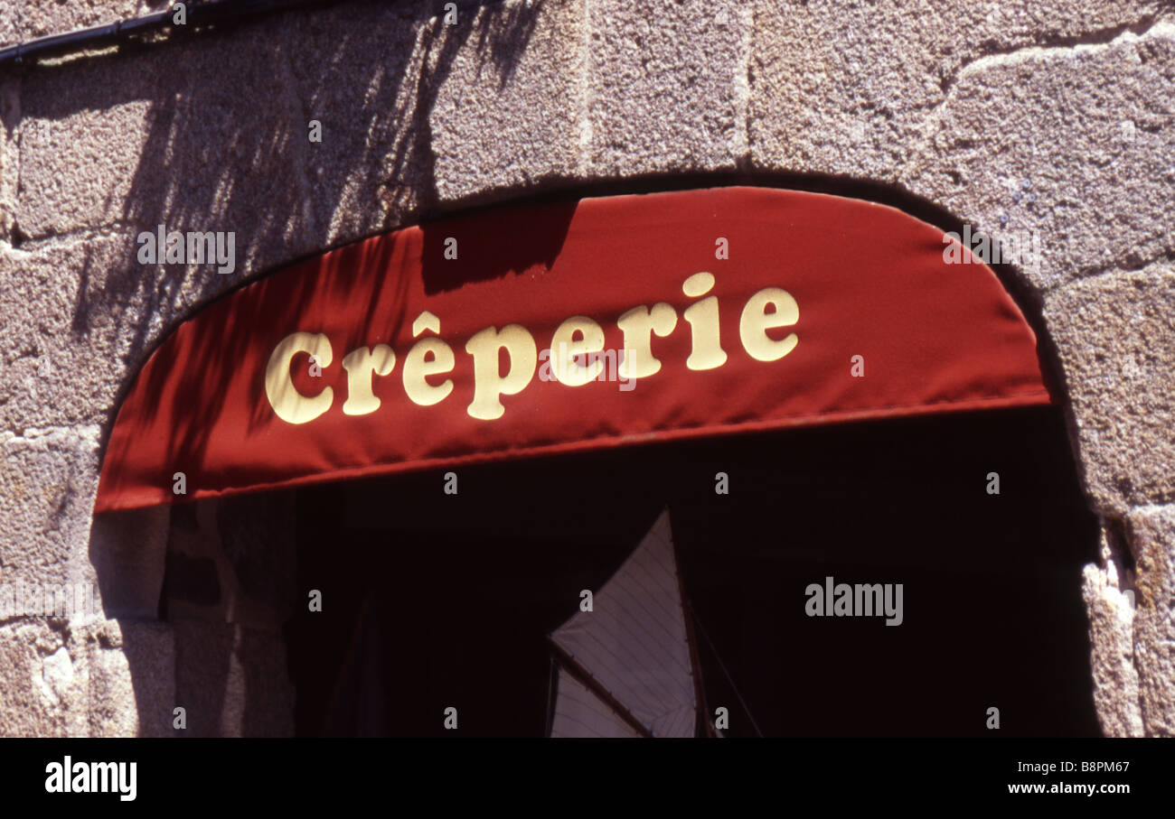 Awning with Creperie sign outside shop in Dinan France Stock Photo - Alamy