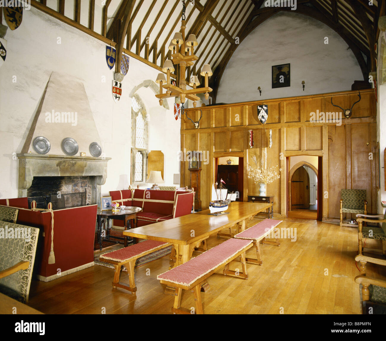Compton Castle The Hall showing the fireplace long table and benches ...