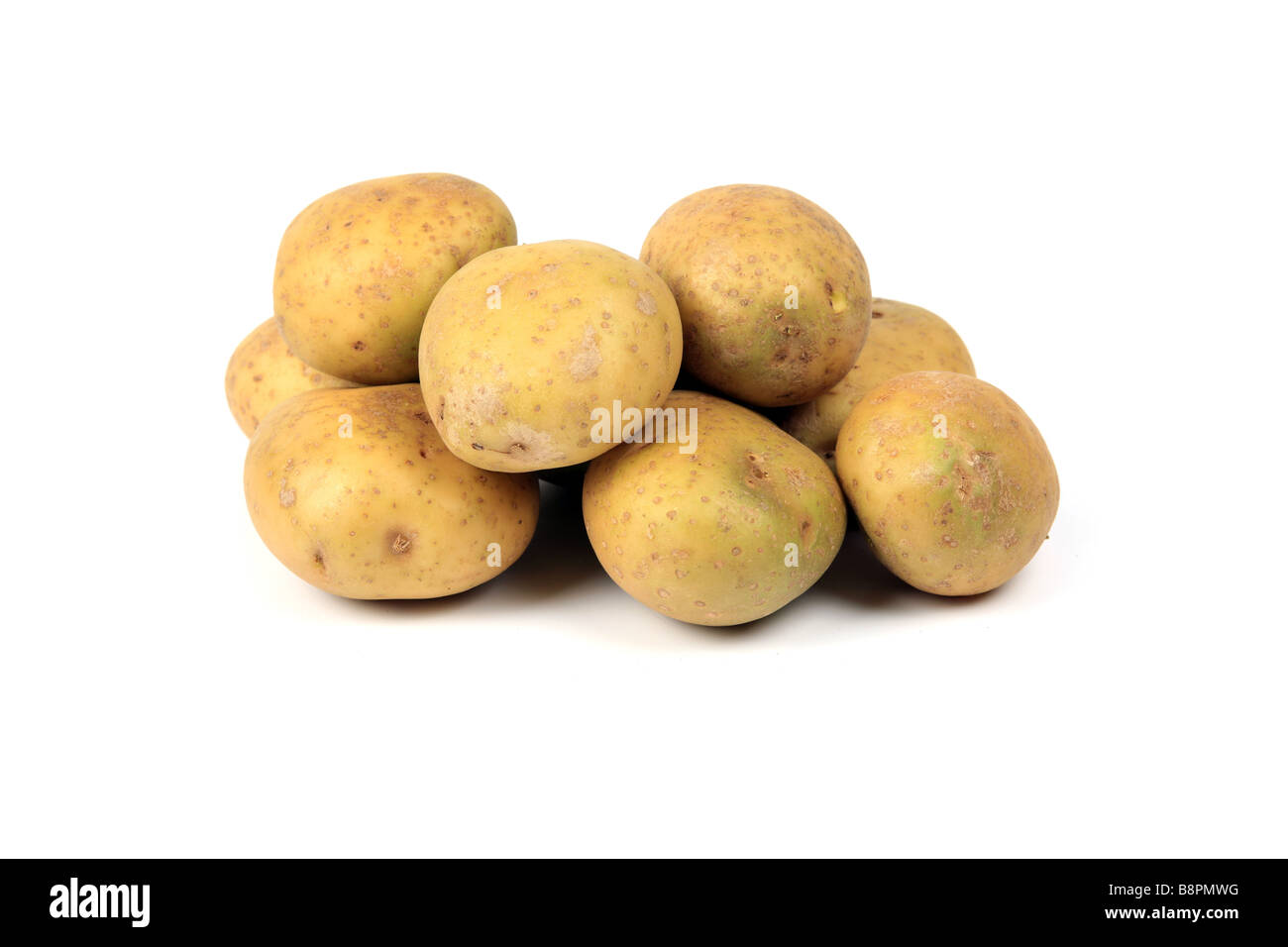 White potatoes staple food of the western world against a white ...