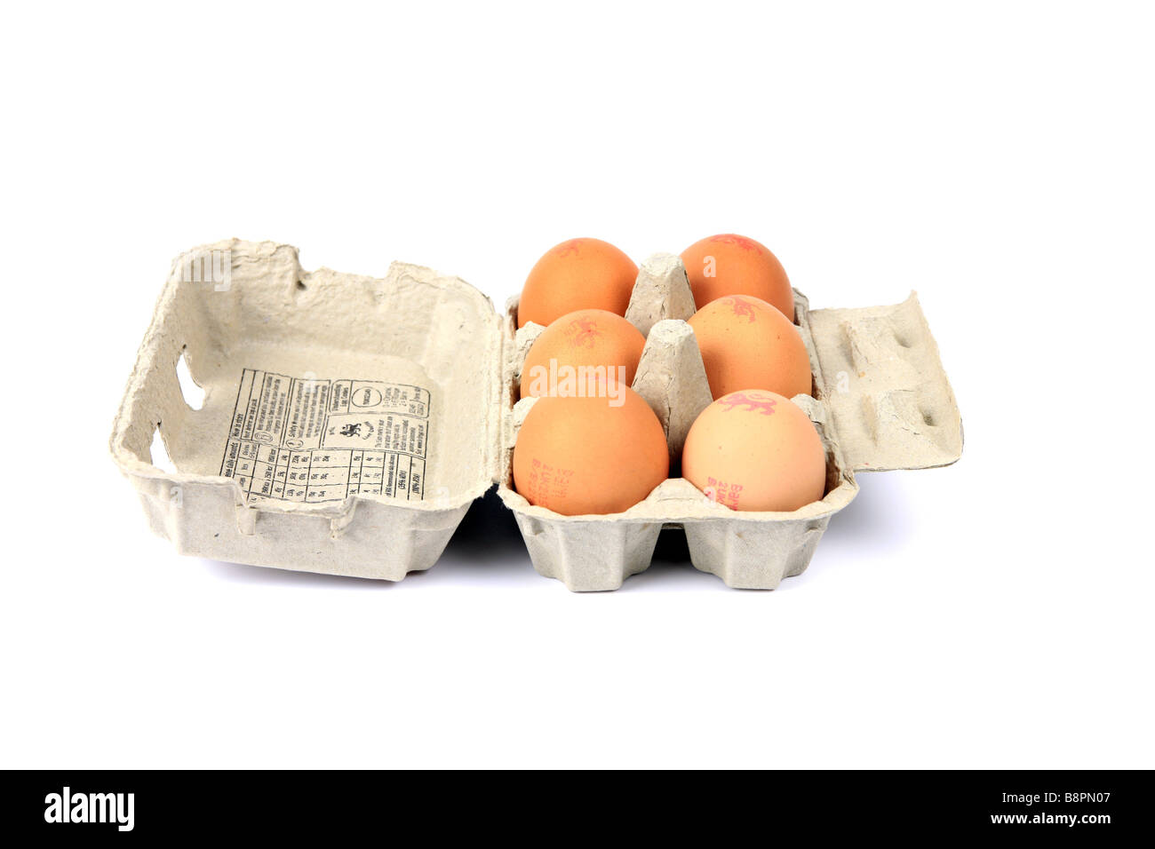 Six eggs in a cardboard egg box against a white background Stock Photo ...