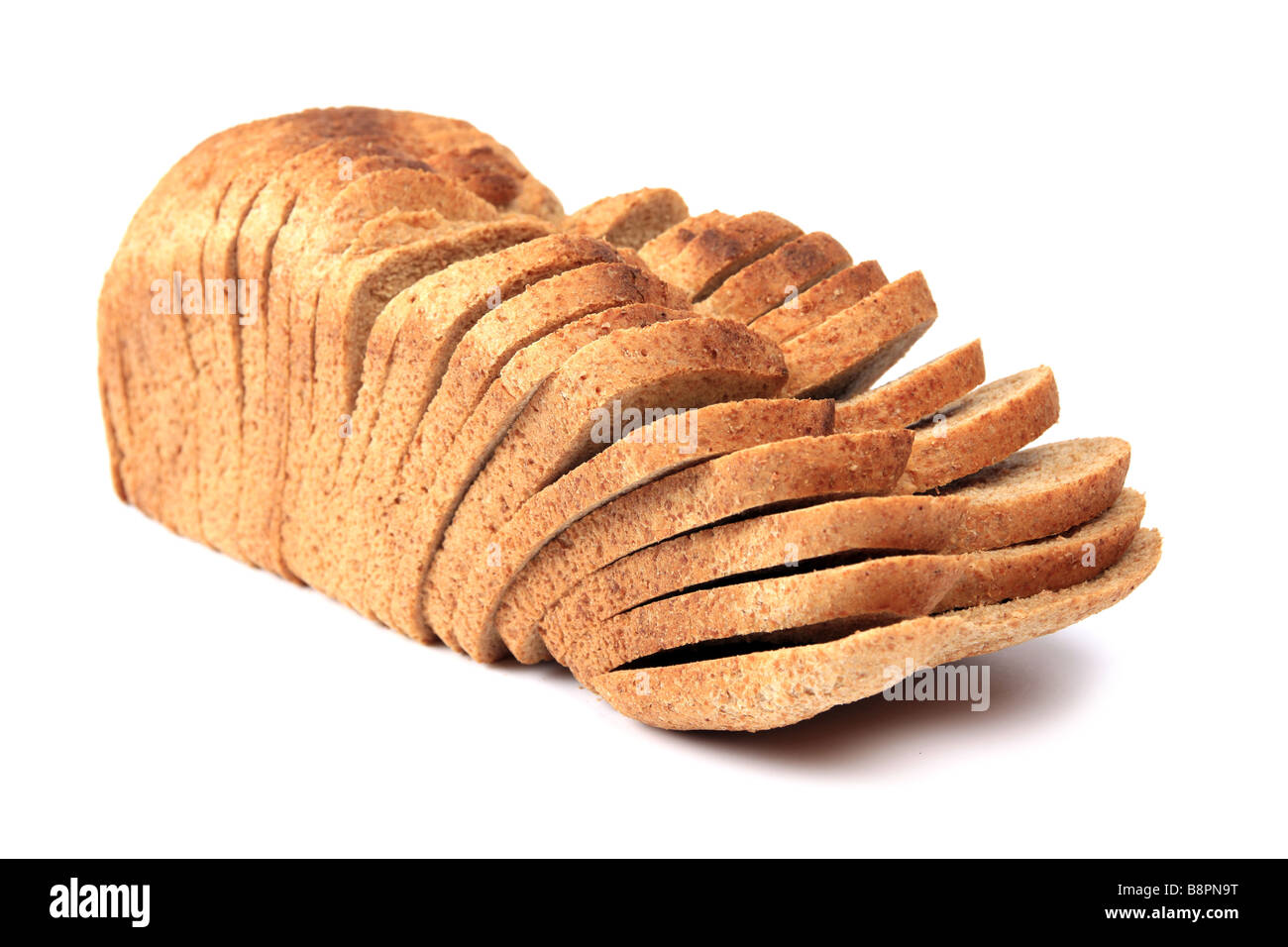 A sliced loaf of wholemeal brown bread against a white background Stock ...