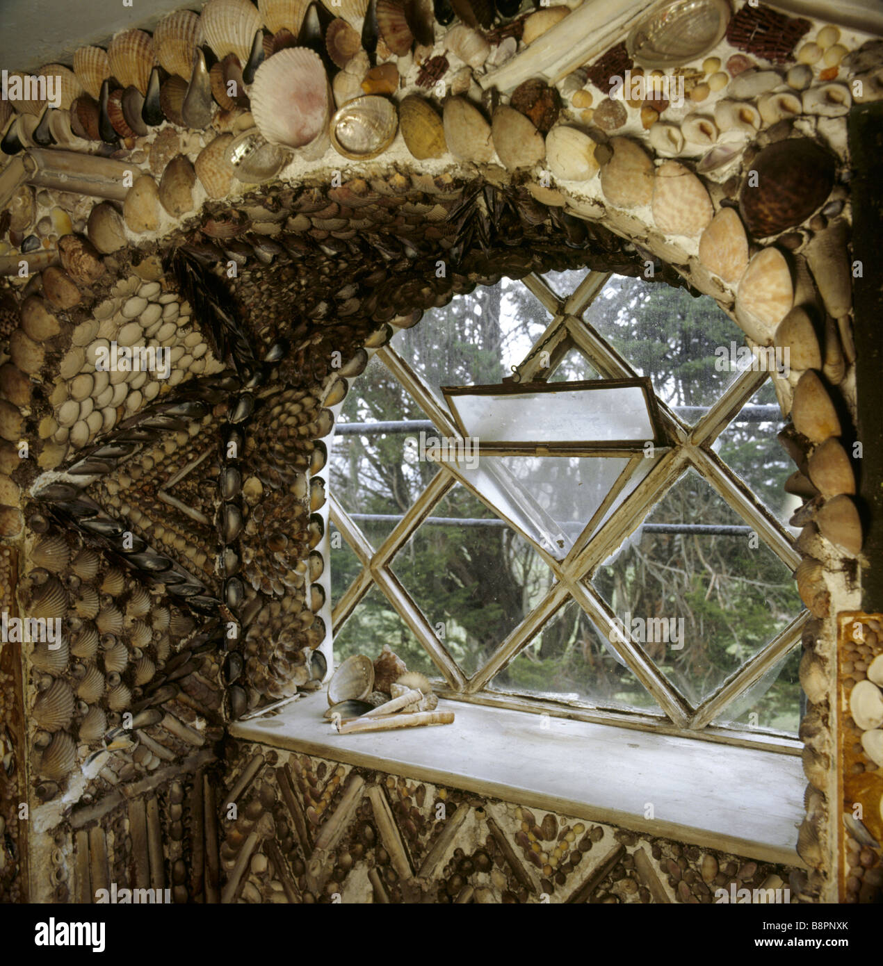 The shell encrusted surround to a window in the Shell Gallery Stock ...