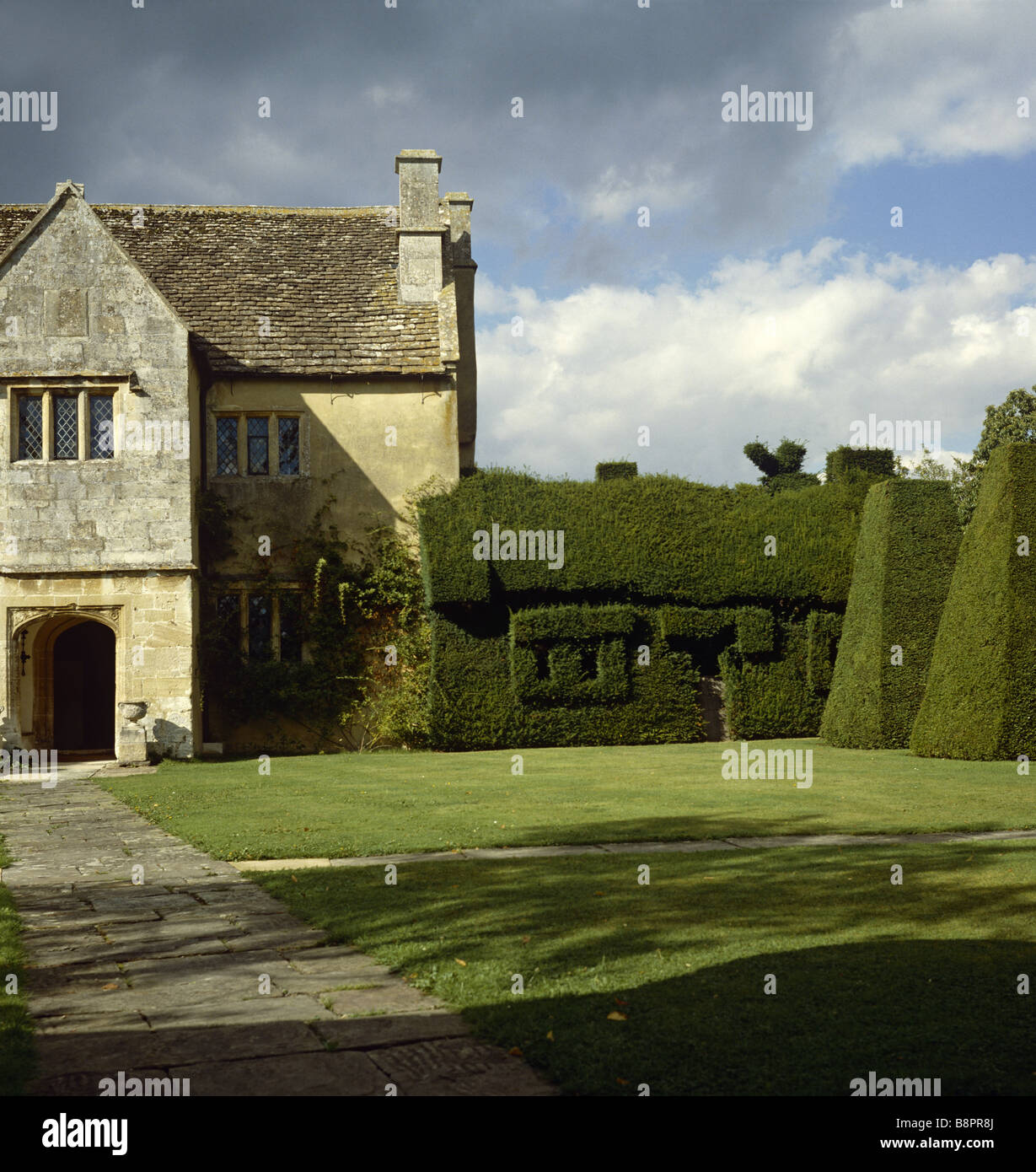 Exterior of the house with topiary Stock Photo - Alamy