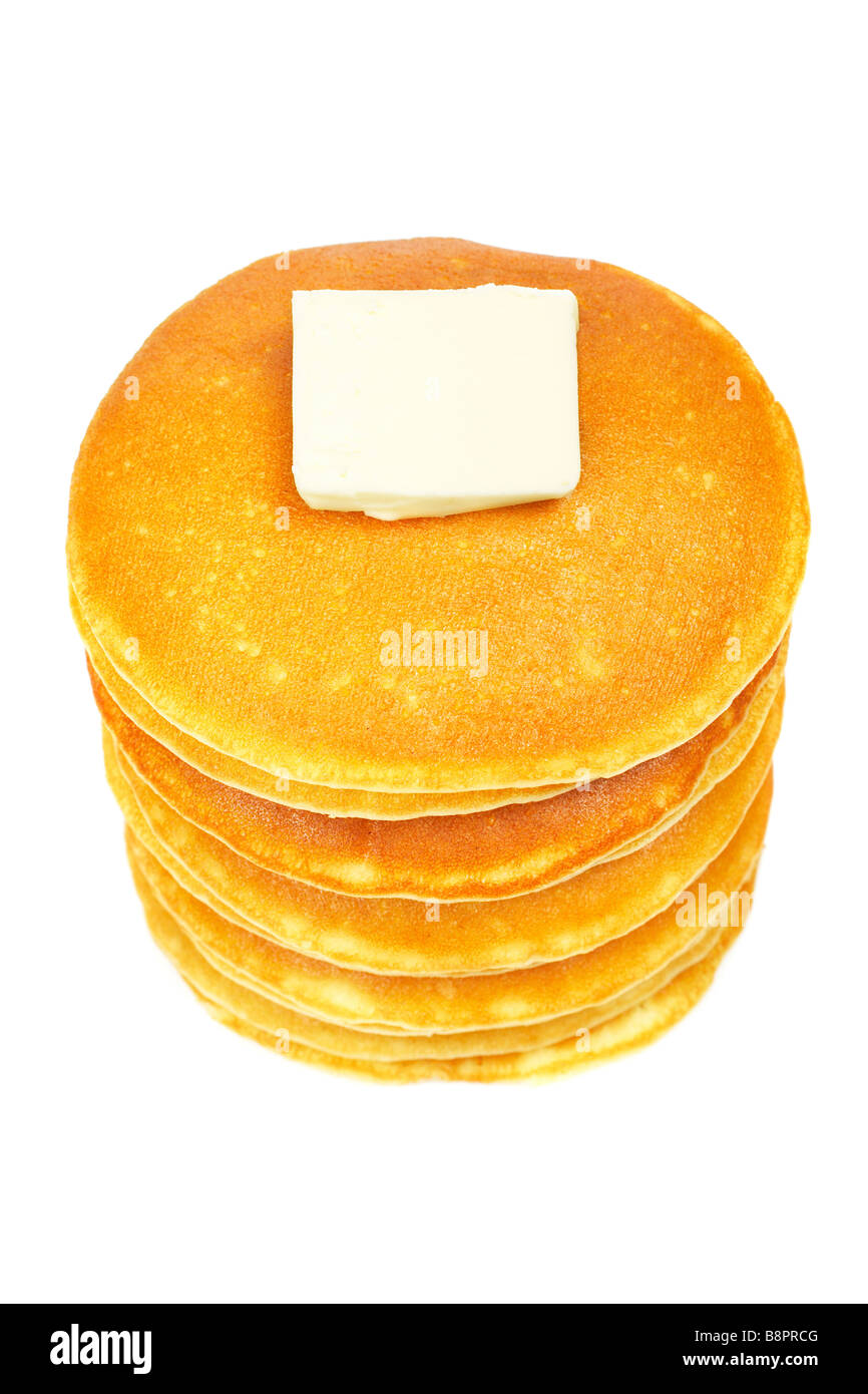 A big stack of pancakes with butter isolated on white background ...