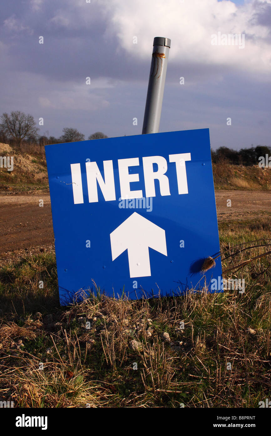 sign reading inert with arrow in disused gravel quarry Stock Photo - Alamy