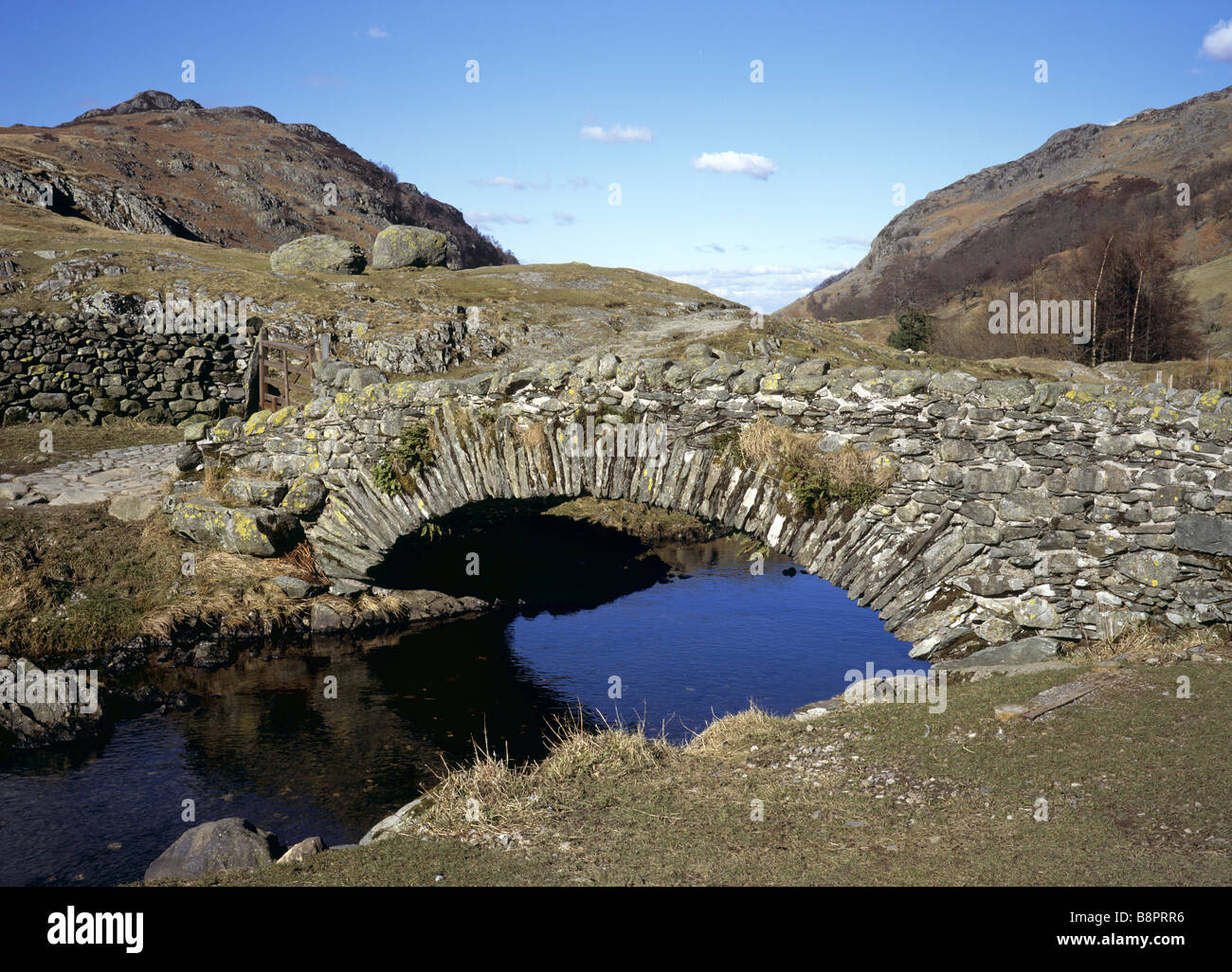 The rough stone bridge at Watendlath high up on the east flank of ...