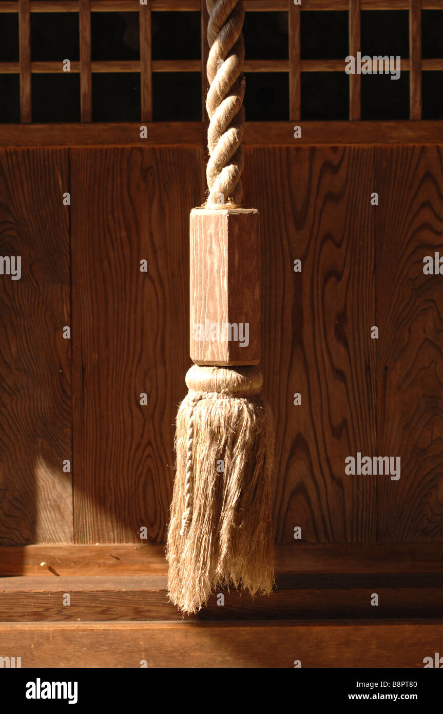 Bell rope in a shinto temple to awaken the gods Takayama Japan Stock ...
