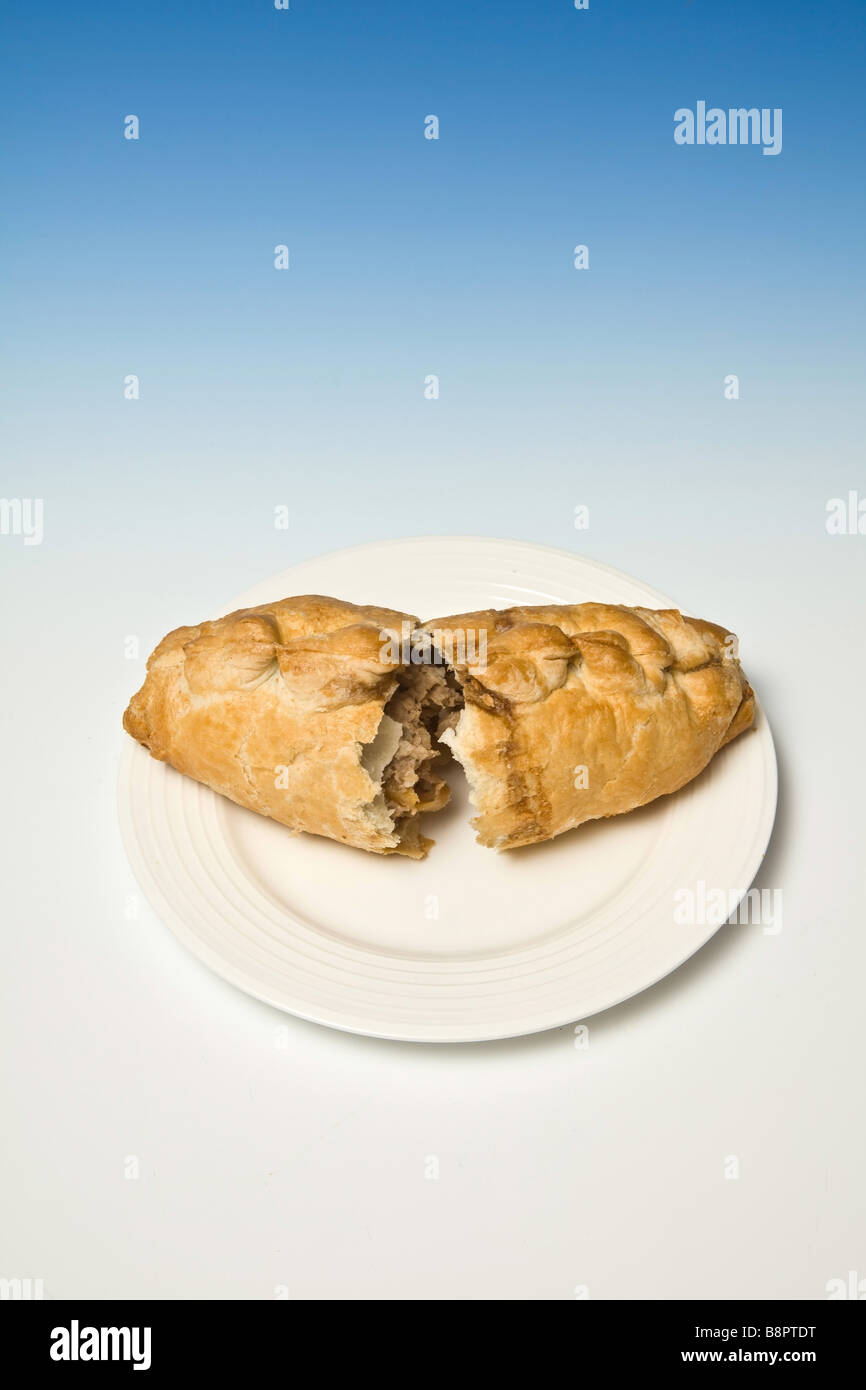 Cornish pasty on a graduated blue studio background Stock Photo - Alamy