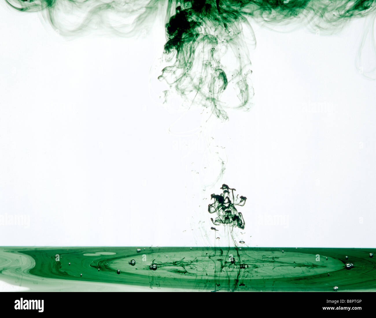 photograph of clouds of green ink in water Stock Photo - Alamy