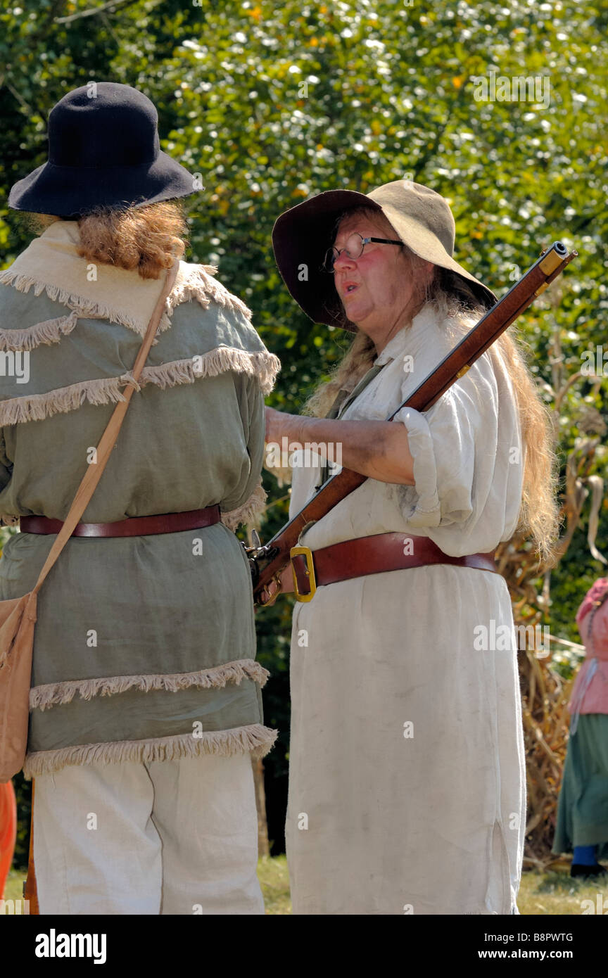 Woman pioneer defenders with flintlock rifle at the Siege of ...
