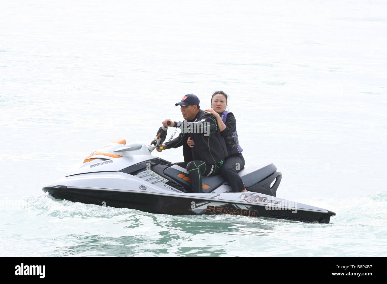 Jet ski couple hi-res stock photography and images - Alamy