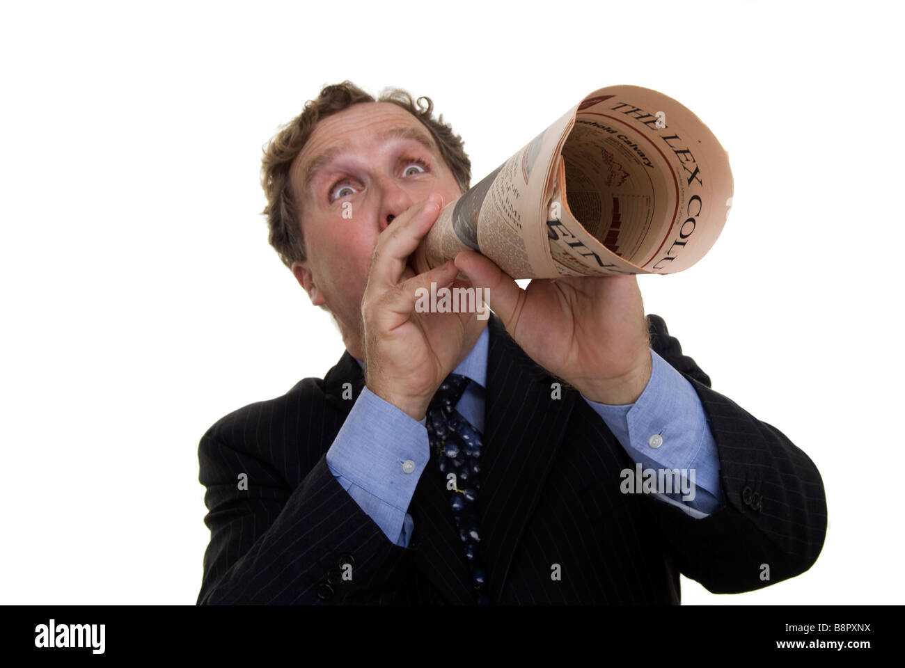 businessman shouting through rolled up financial paper Stock Photo - Alamy