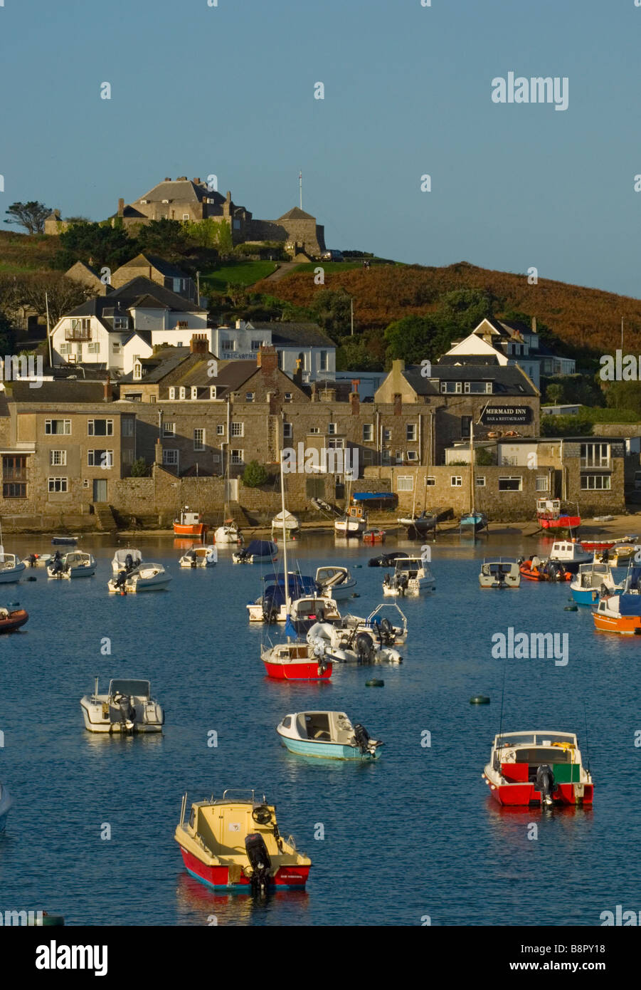 A view of Hugh Town Harbour showing The Mermaid Inn and The Star Castle ...