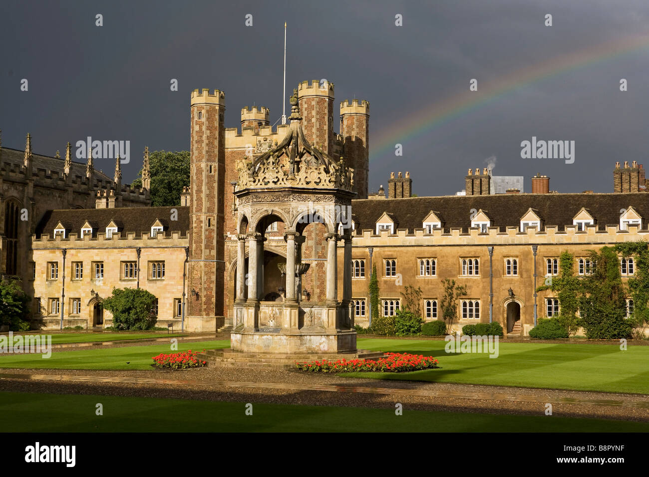 Black skies and rainbow over Trinity College Cambridge, England Stock ...