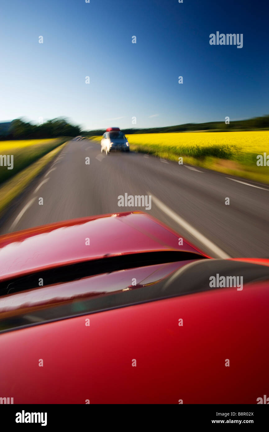 Cars on a countryroad Stock Photo - Alamy