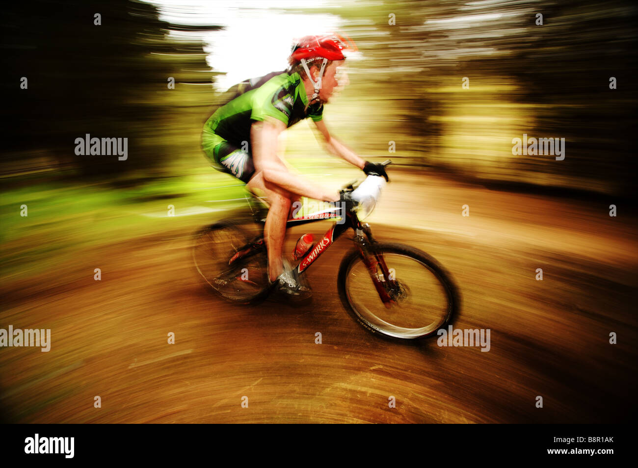 Mountain Bike rider at speed in woods Stock Photo - Alamy